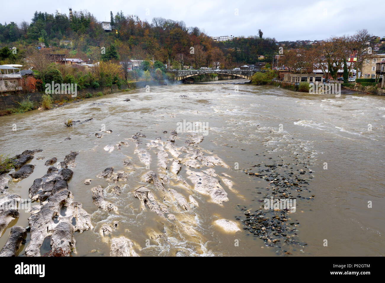 Majestic Rioni river flowing through Kutaisi town in Georgia. View from ...