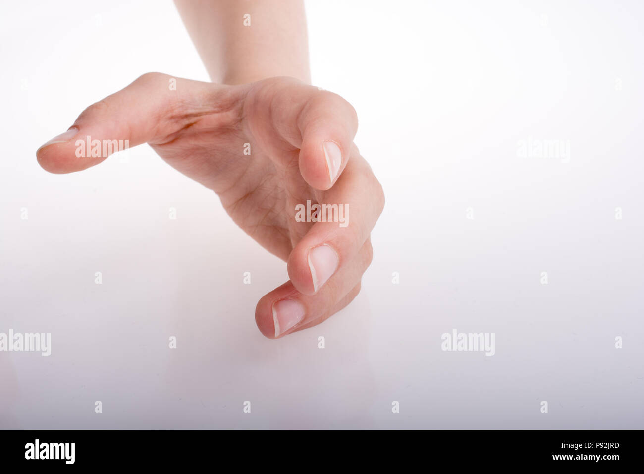 Hand holding on a white background Stock Photo - Alamy