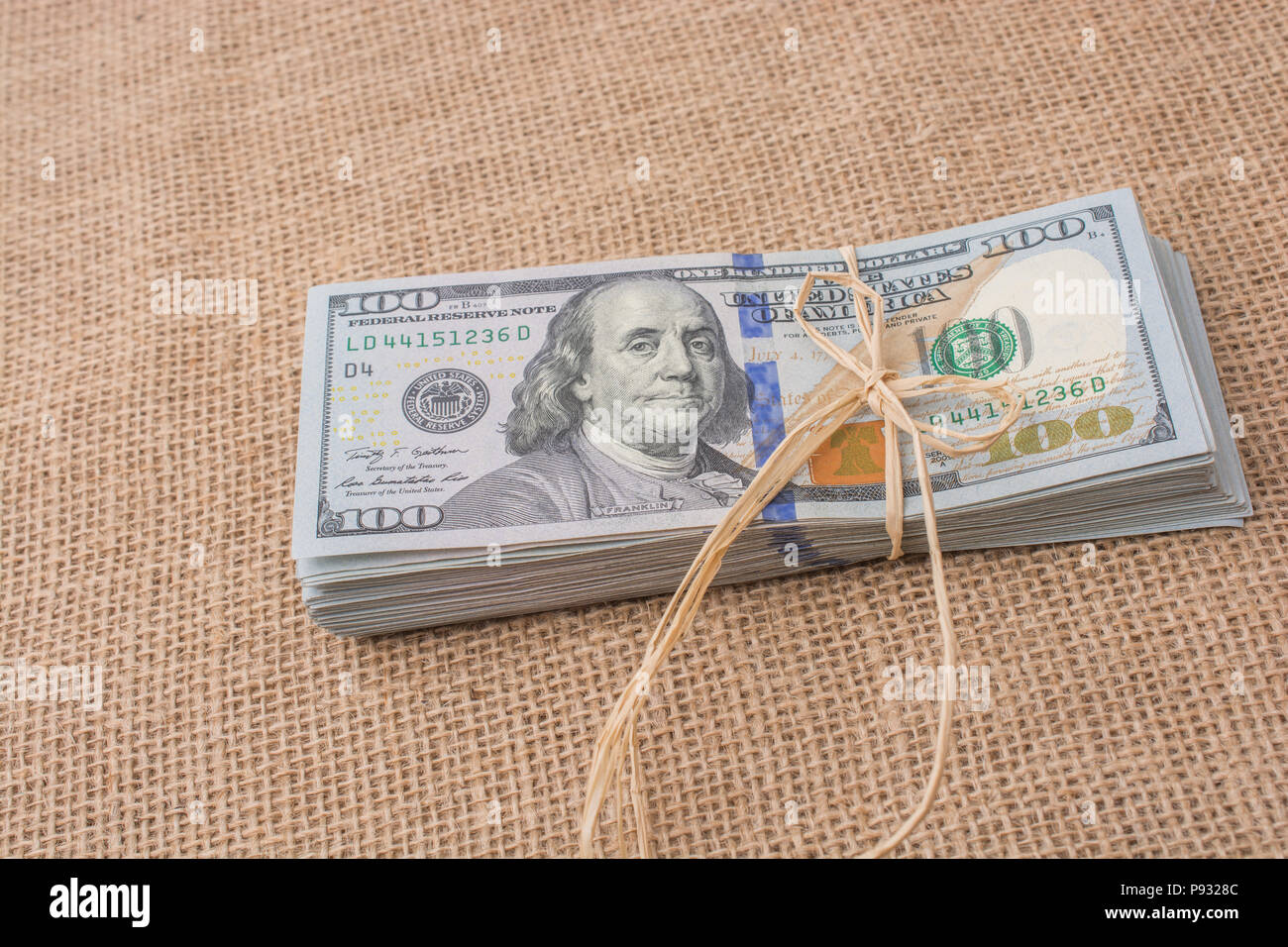 Banknote bundle of US dollar tied with colorful a ribbon Stock Photo ...