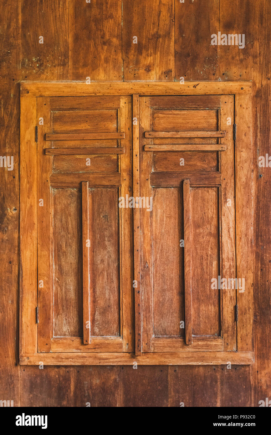 Closed wooden window with shutters Stock Photo - Alamy