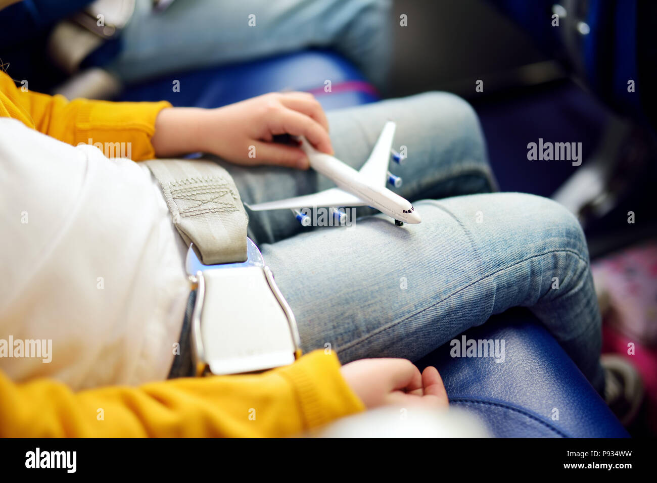 Adorable little girls traveling by an airplane. Children sitting by ...