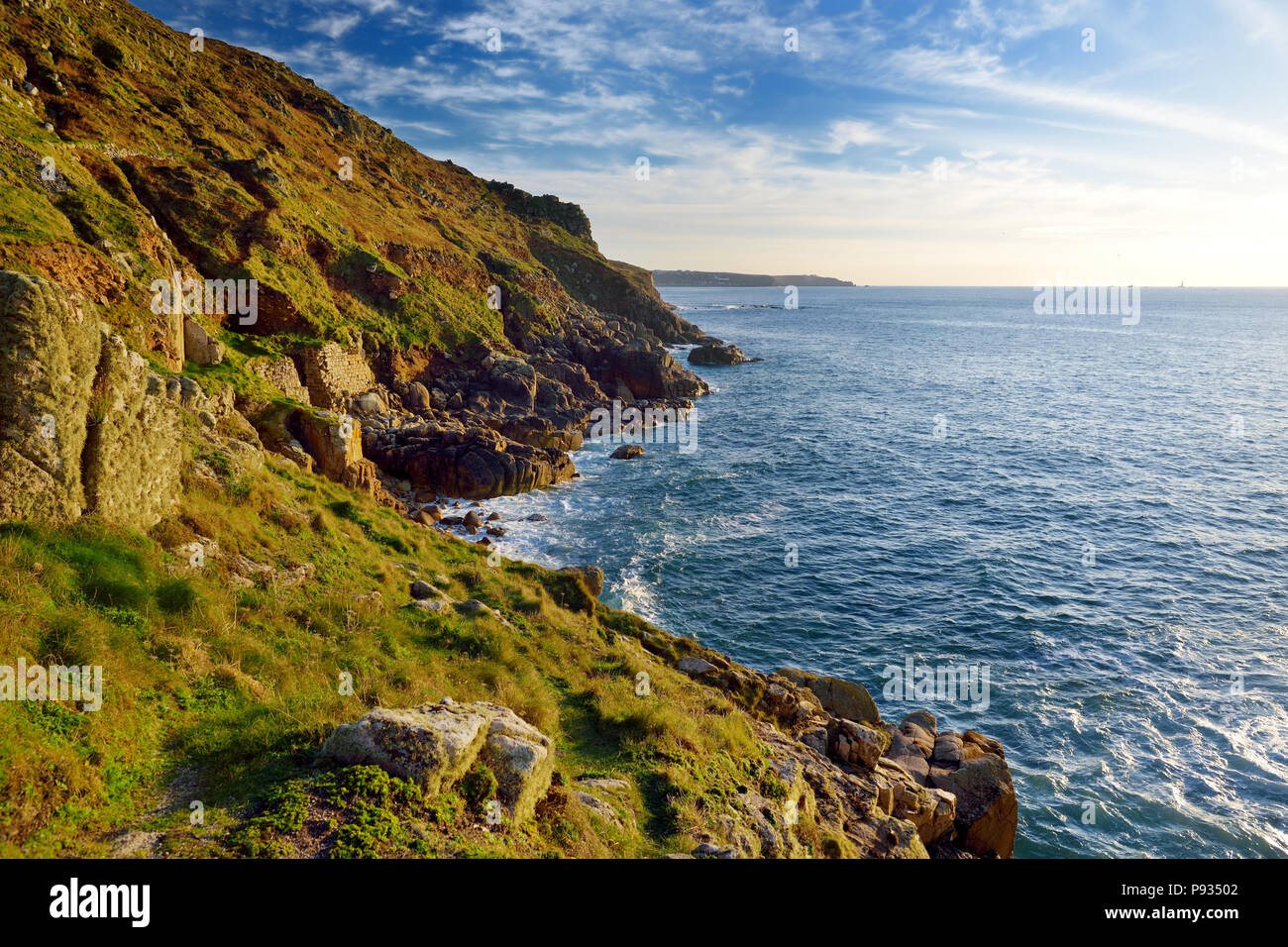 Scenic rugged Cornish coastline at Porth Nanven on sunny evening ...