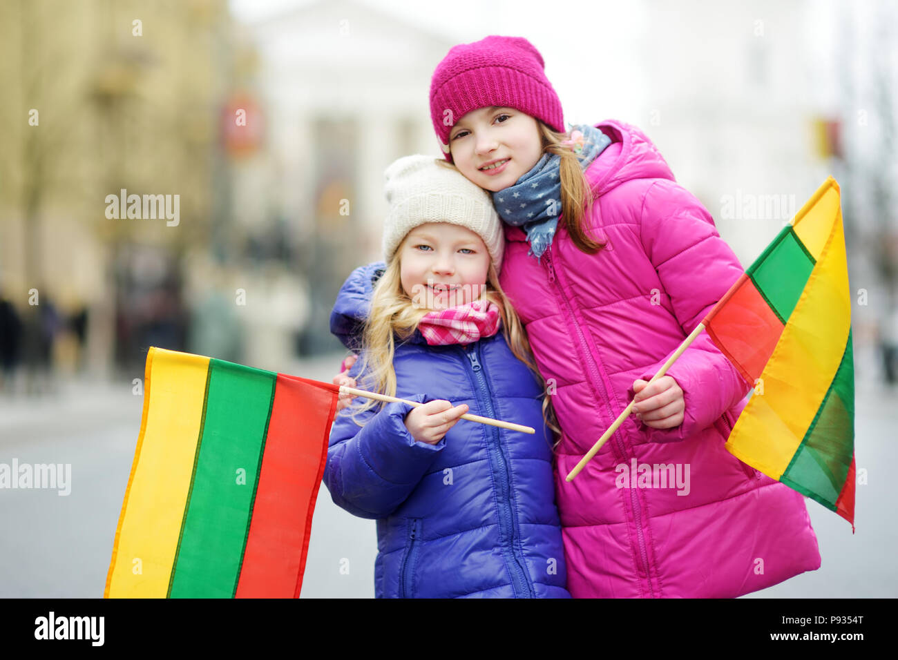 Two adorable little sisters celebrating Lithuanian Independence Day ...