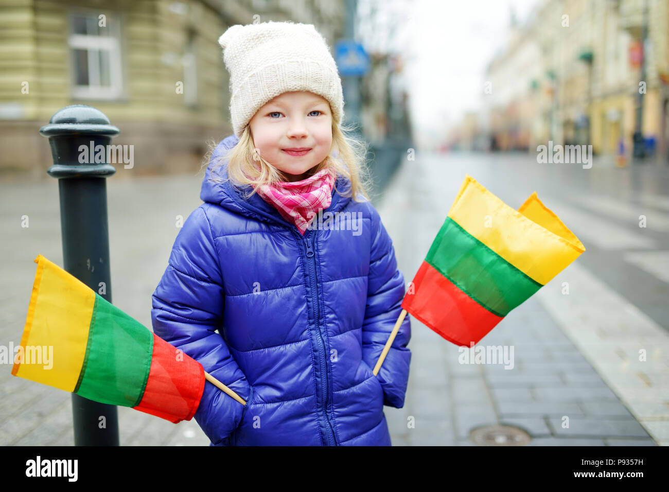 Cute little girl celebrating Lithuanian Independence Day holding ...