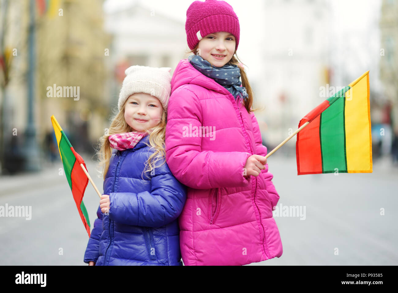 Two adorable little sisters celebrating Lithuanian Independence Day ...