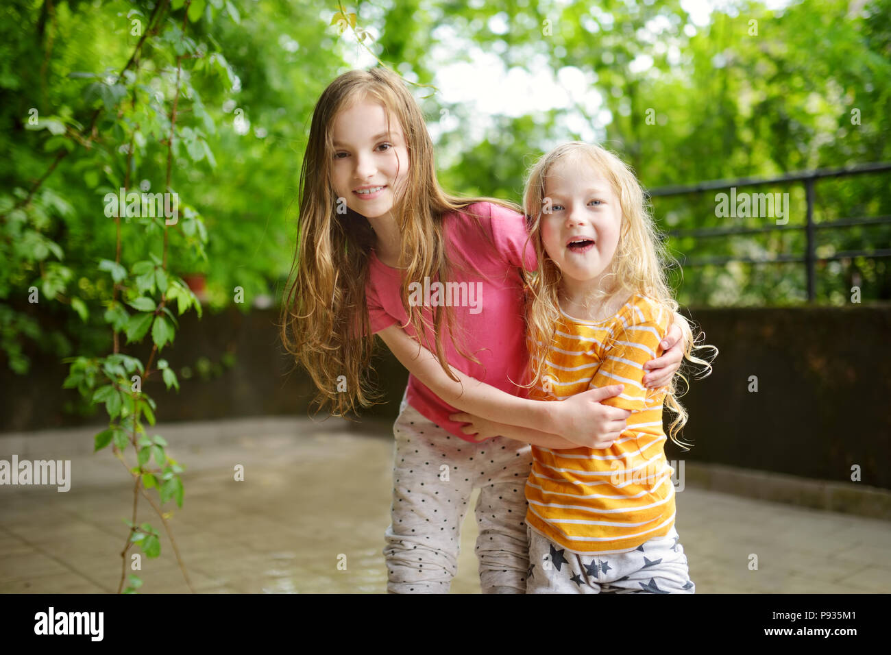 Two Little Sisters Hugging