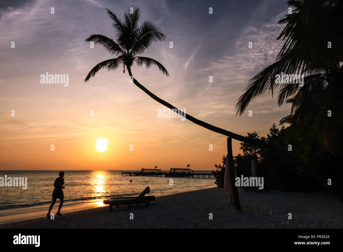 Woman Running on Beach at Sunset in Maldives Island Resort Stock Photo ...