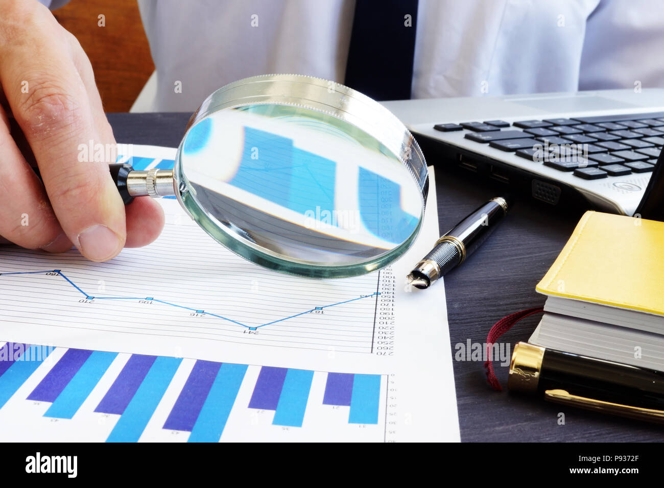 Checking financial statement accountant hi-res stock photography and ...