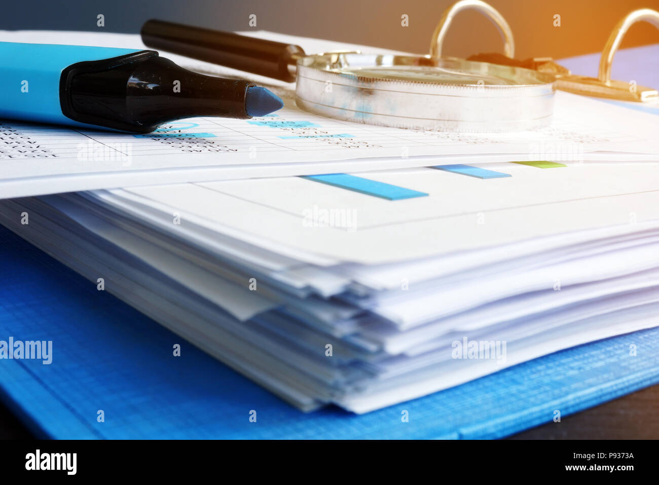 Folder with financial report and magnifying glass. Internal audit Stock ...