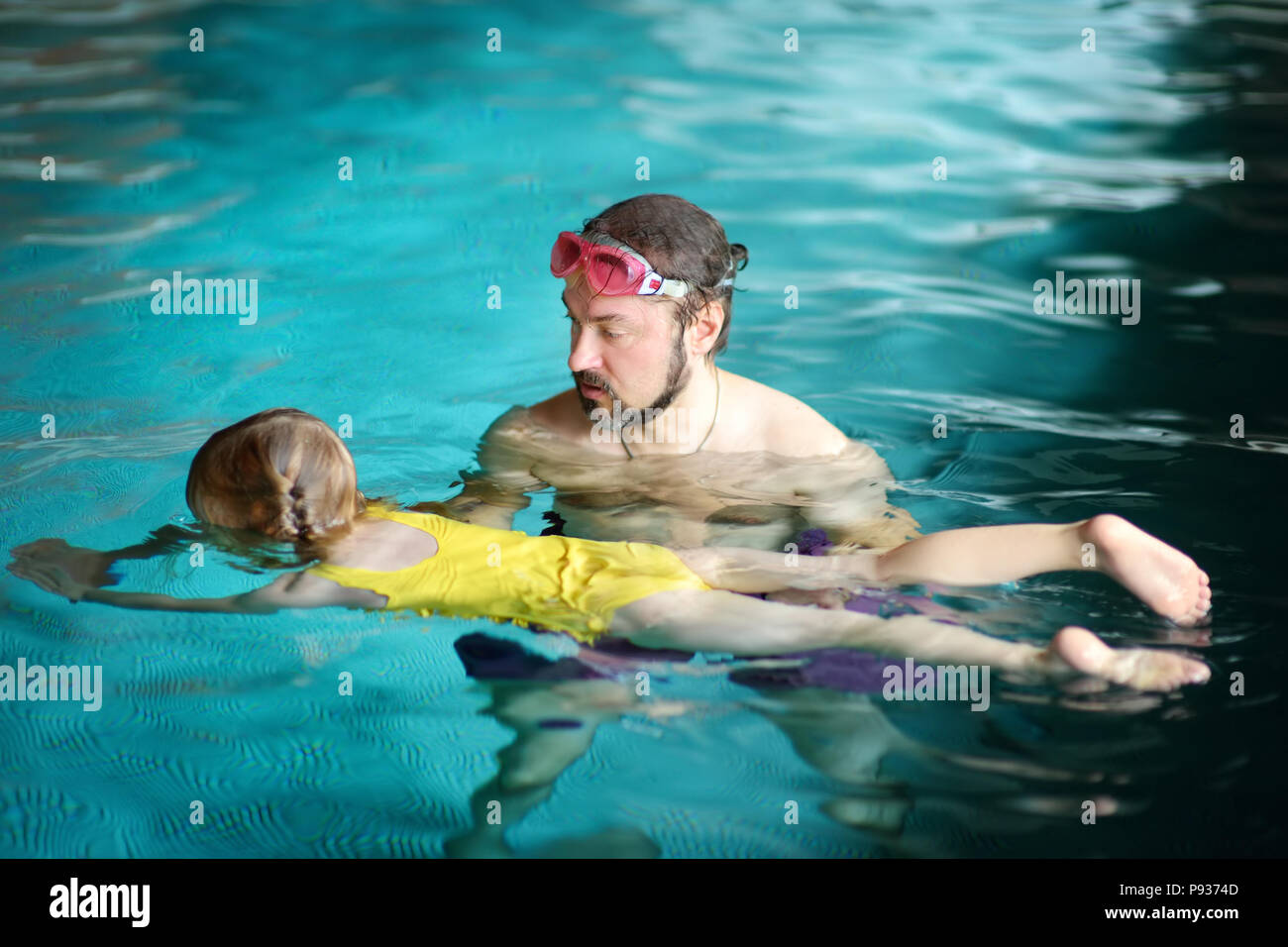 Father teaching daughter swim hi-res stock photography and images - Alamy
