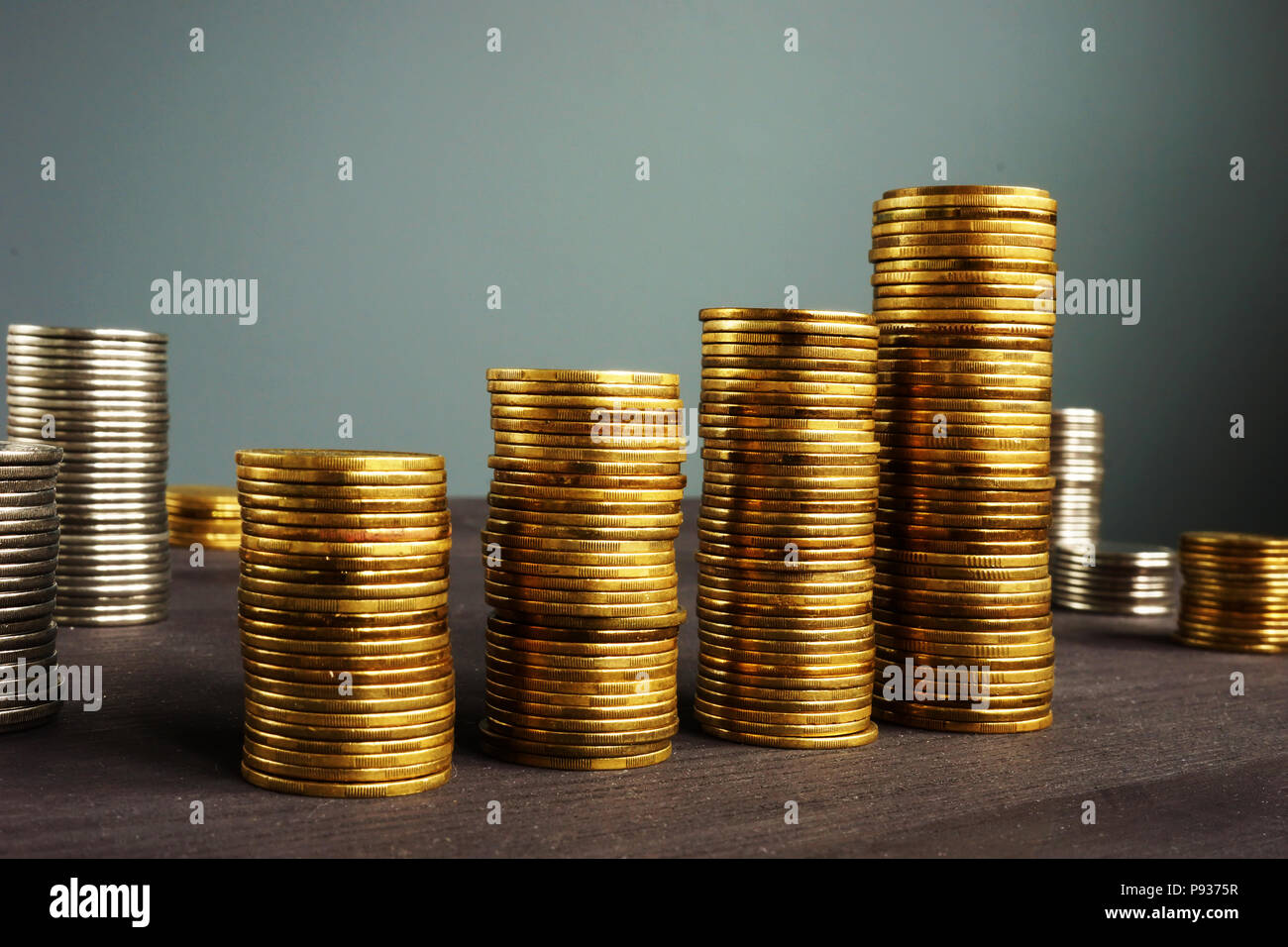 Business success. Coins stackson a desk. Financial growth Stock Photo ...