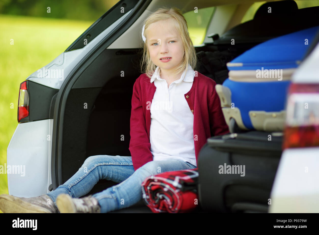 Adorable little girl ready to go on vacations with her parents. Child ...