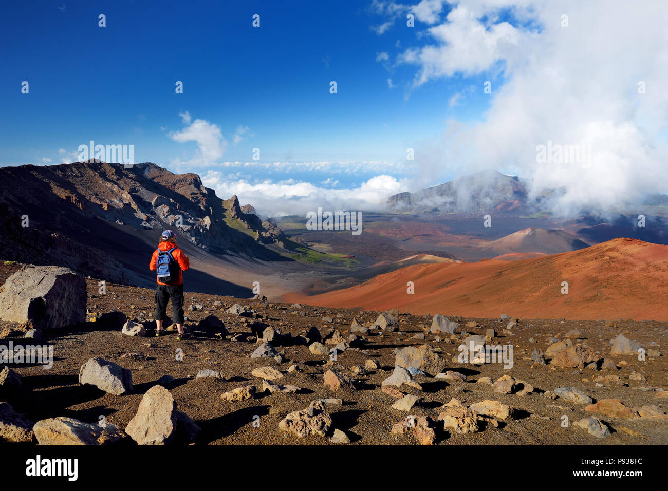 Tourist hiking in Haleakala volcano crater on the Sliding Sands trail ...