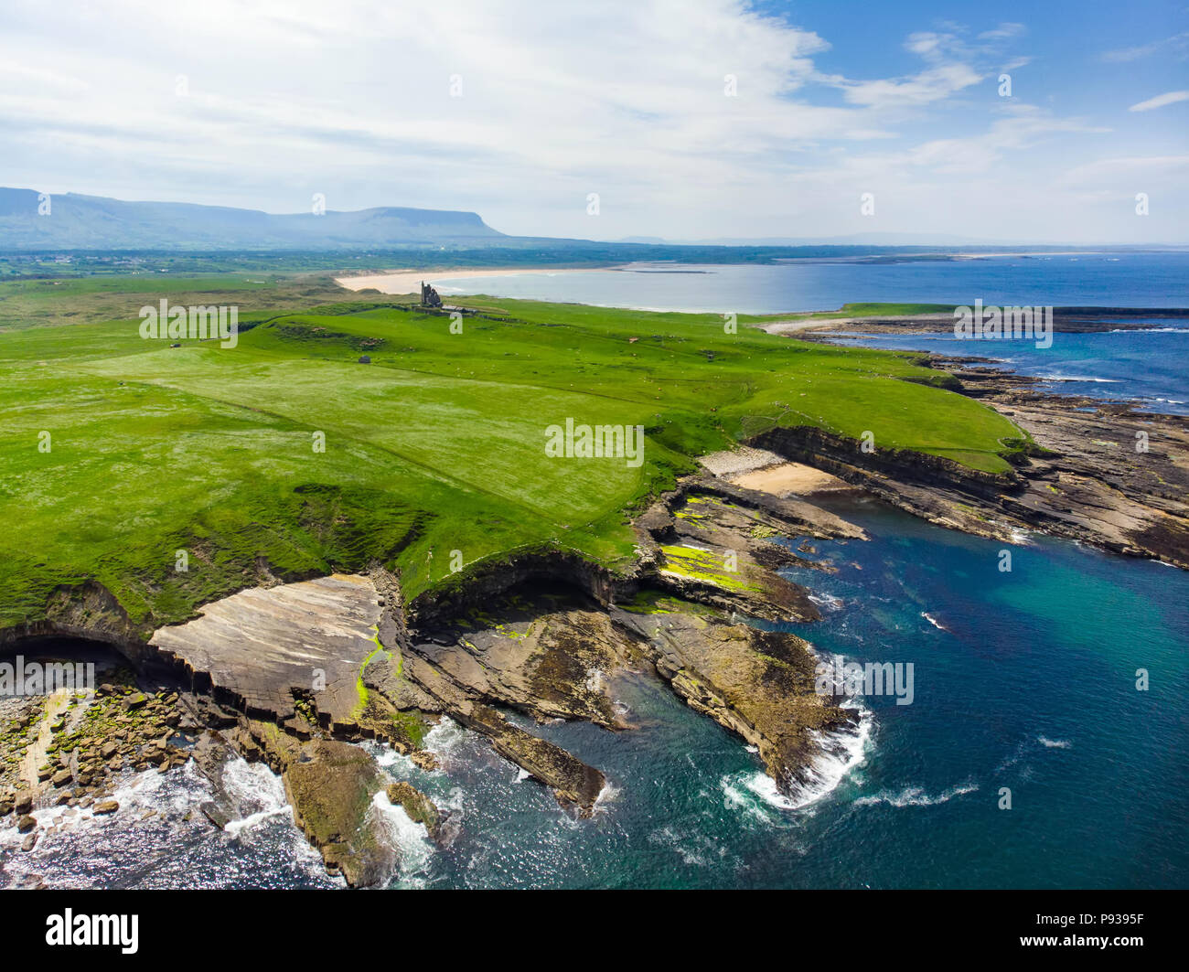 Spectacular aerial view of Mullaghmore Head with huge waves rolling ...