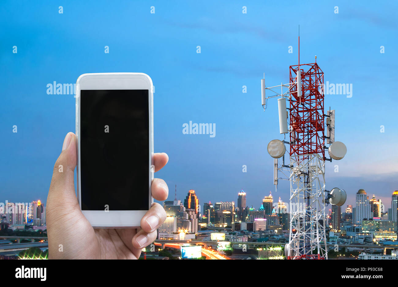 Man's hand shows white smartphone in vertical position on technology ...