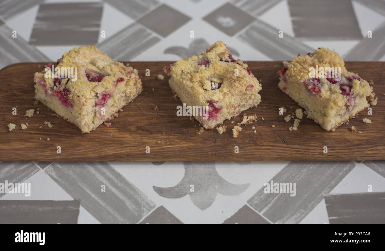 Raspberry and white chocolate crumble tray bake Stock Photo - Alamy