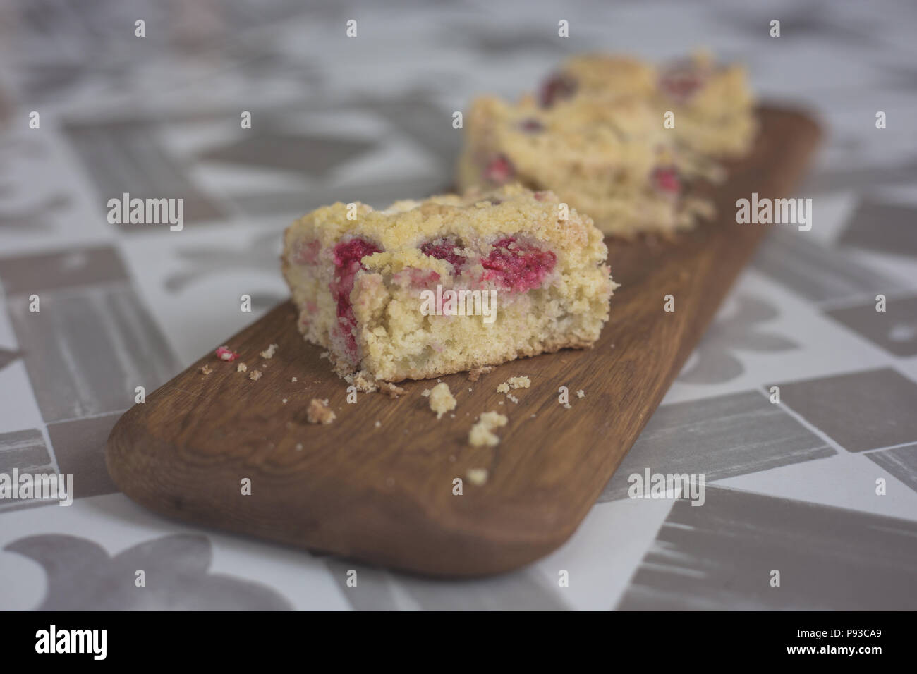Raspberry and white chocolate crumble tray bake Stock Photo - Alamy