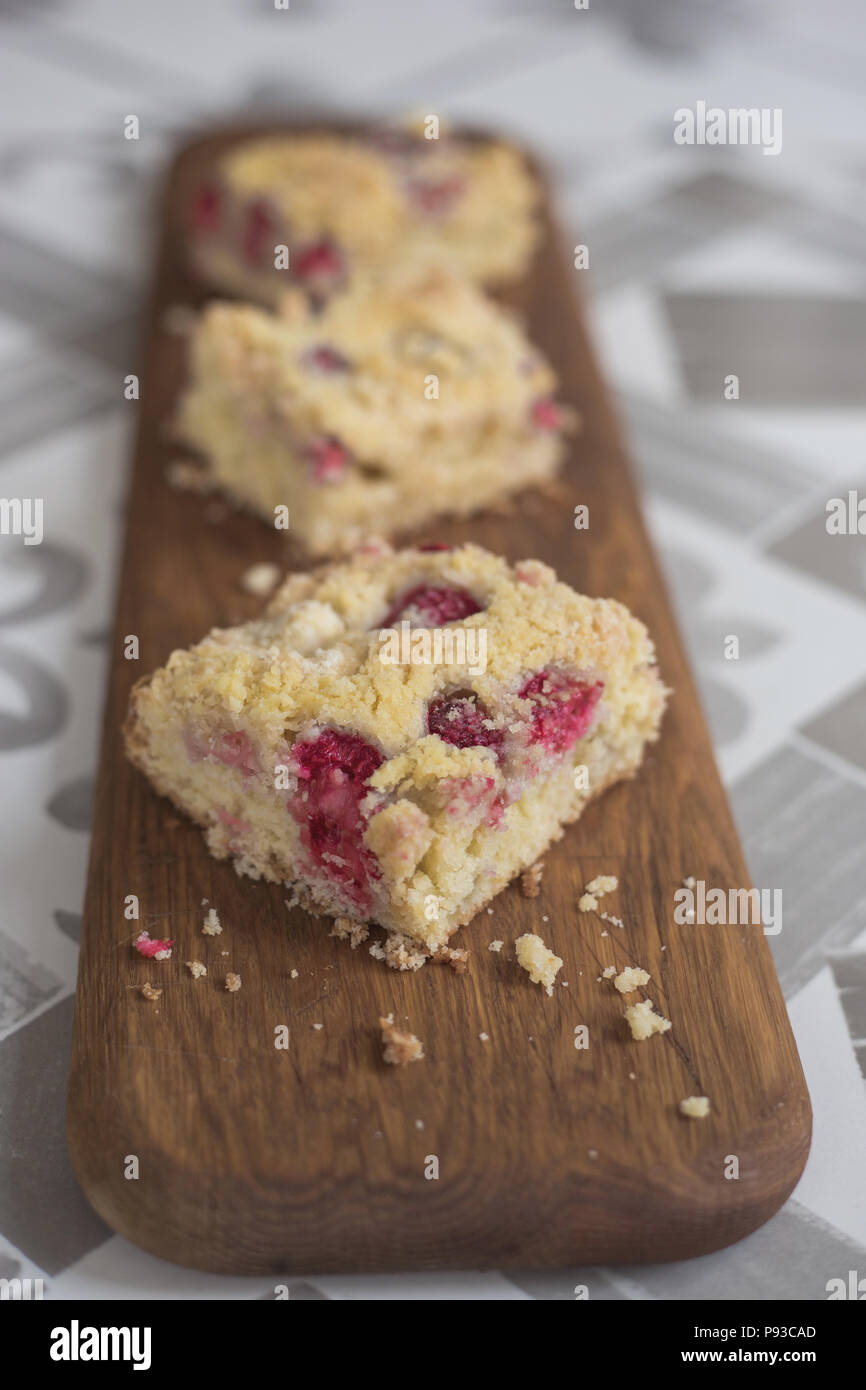 Raspberry and white chocolate crumble tray bake Stock Photo - Alamy