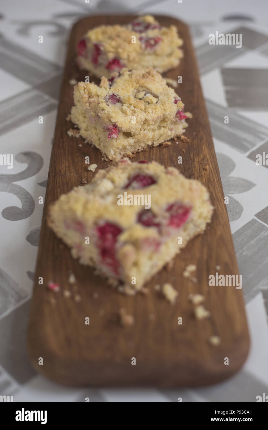 Raspberry and white chocolate crumble tray bake Stock Photo - Alamy