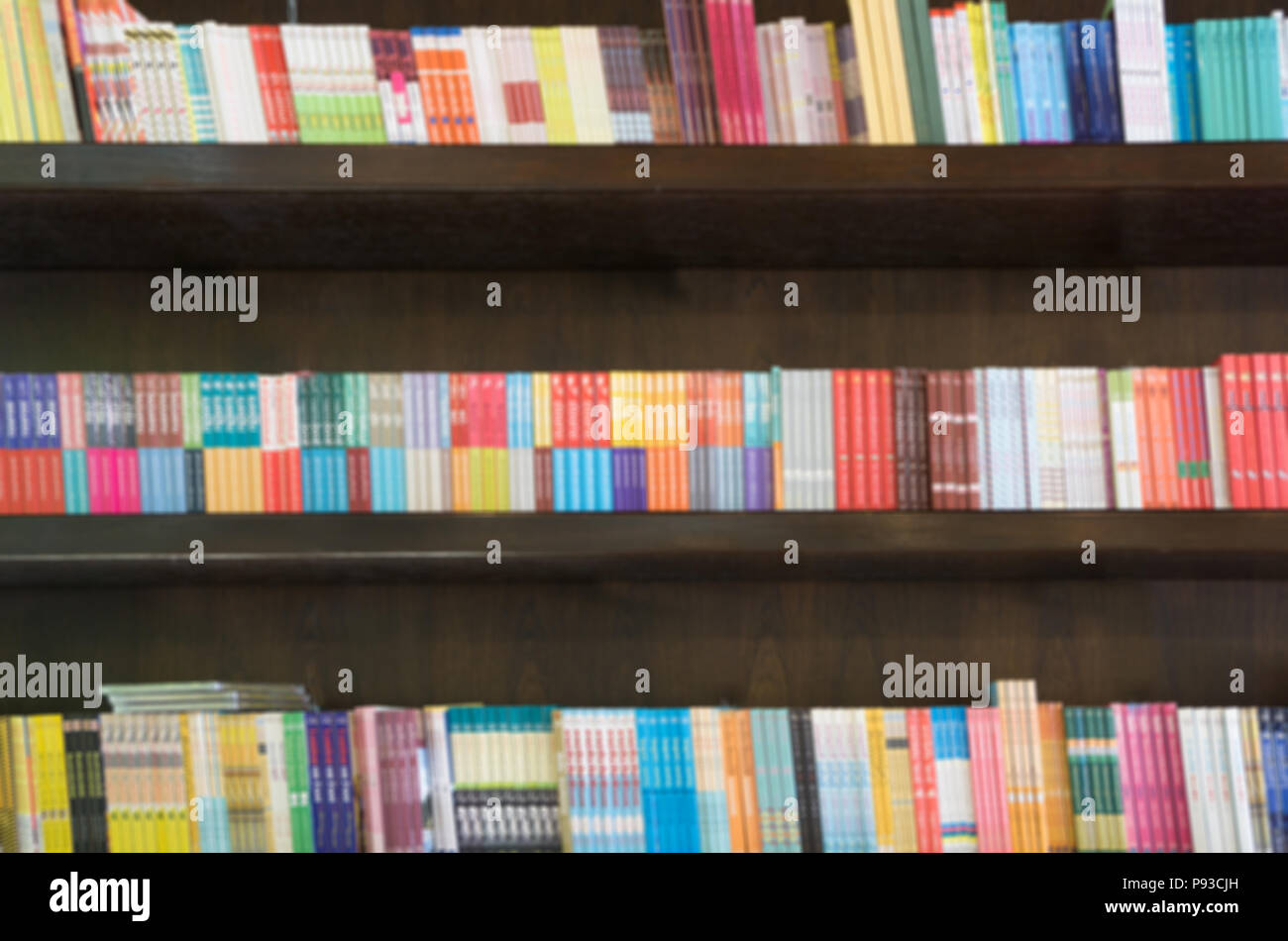 Blured books in public library. Blured effect. Background for you ...