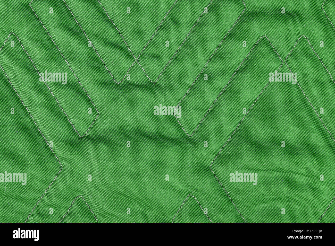 Green quilted fabric texture with geometric pattern Stock Photo - Alamy