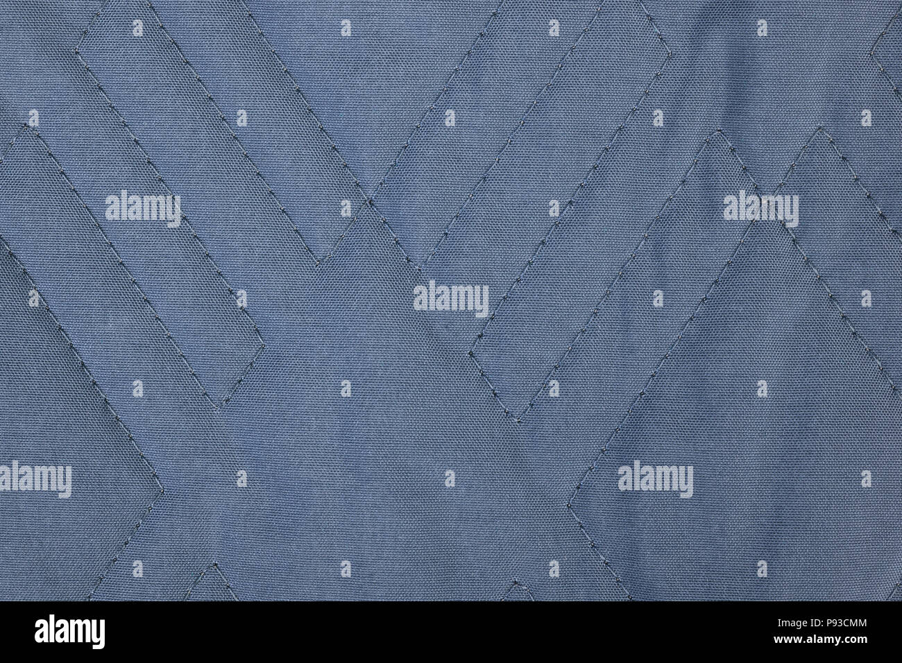 Blue quilted fabric texture with geometric pattern Stock Photo - Alamy