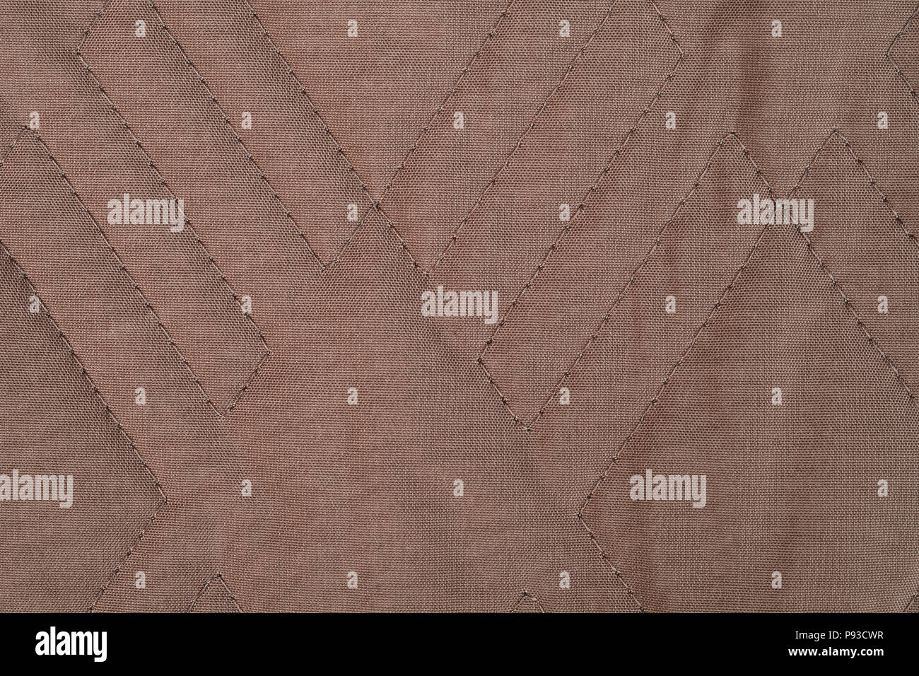 Brown quilted fabric texture with geometric pattern Stock Photo - Alamy