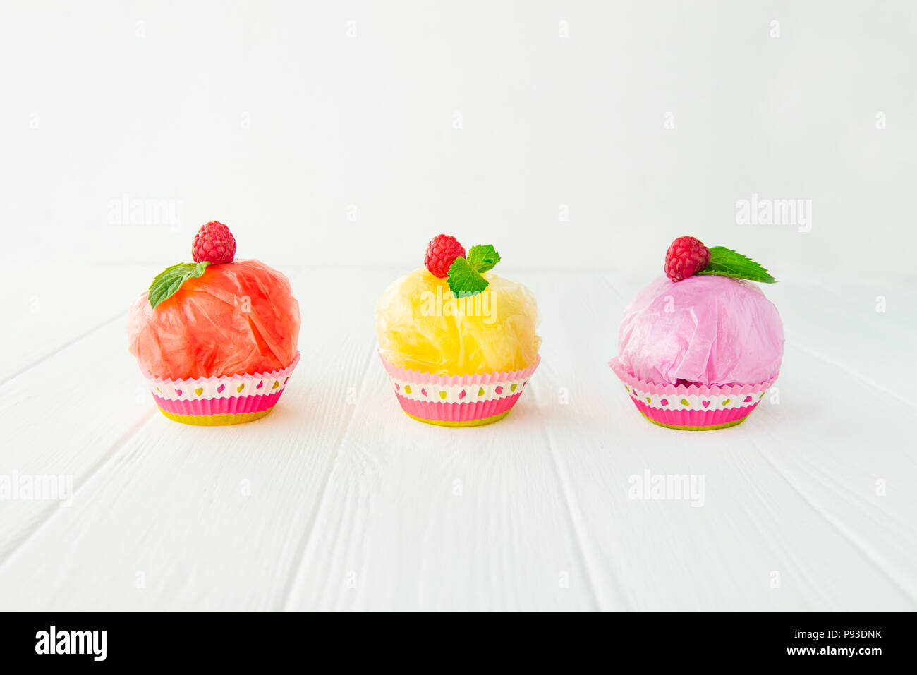 Concept of artificial, plastic food. GMO, Enumbers modified sweets ...