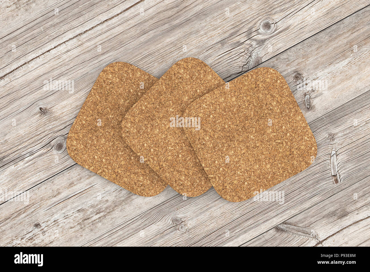 Beer cork square coasters. Isolated on wood background. 3d render Stock ...