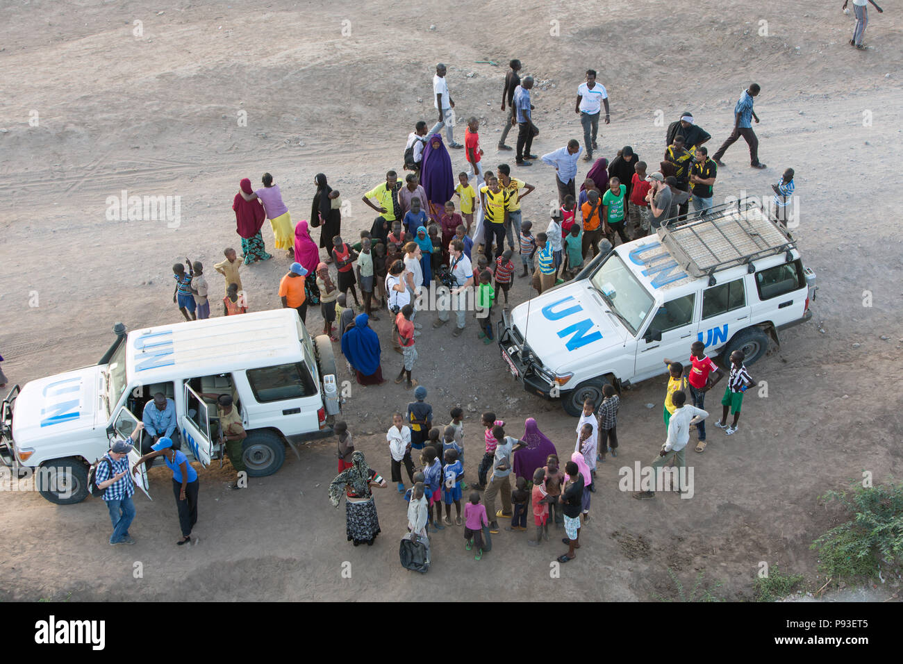 Kakuma, Kenya - Accumulation of refugees around two UN Land Rovers in ...