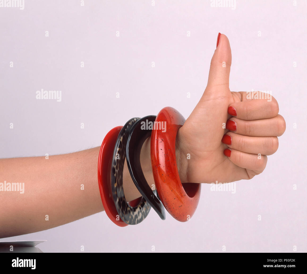 Close-up of red and black bangles on woman's arm FOR EDITORIAL USE ONLY ...