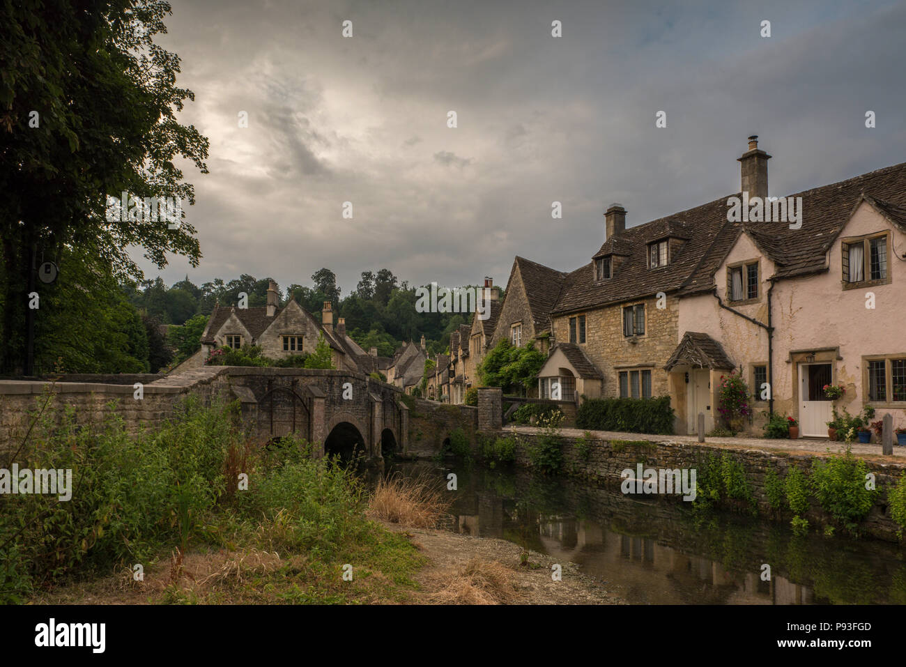 Stone cottages near Bybrook river, Castle Combe, village, Cotswolds ...