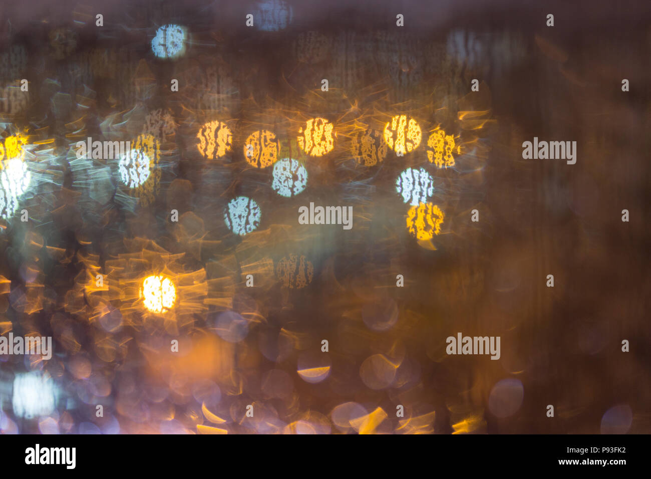 Drops of rain on window, night. blurred light Stock Photo - Alamy