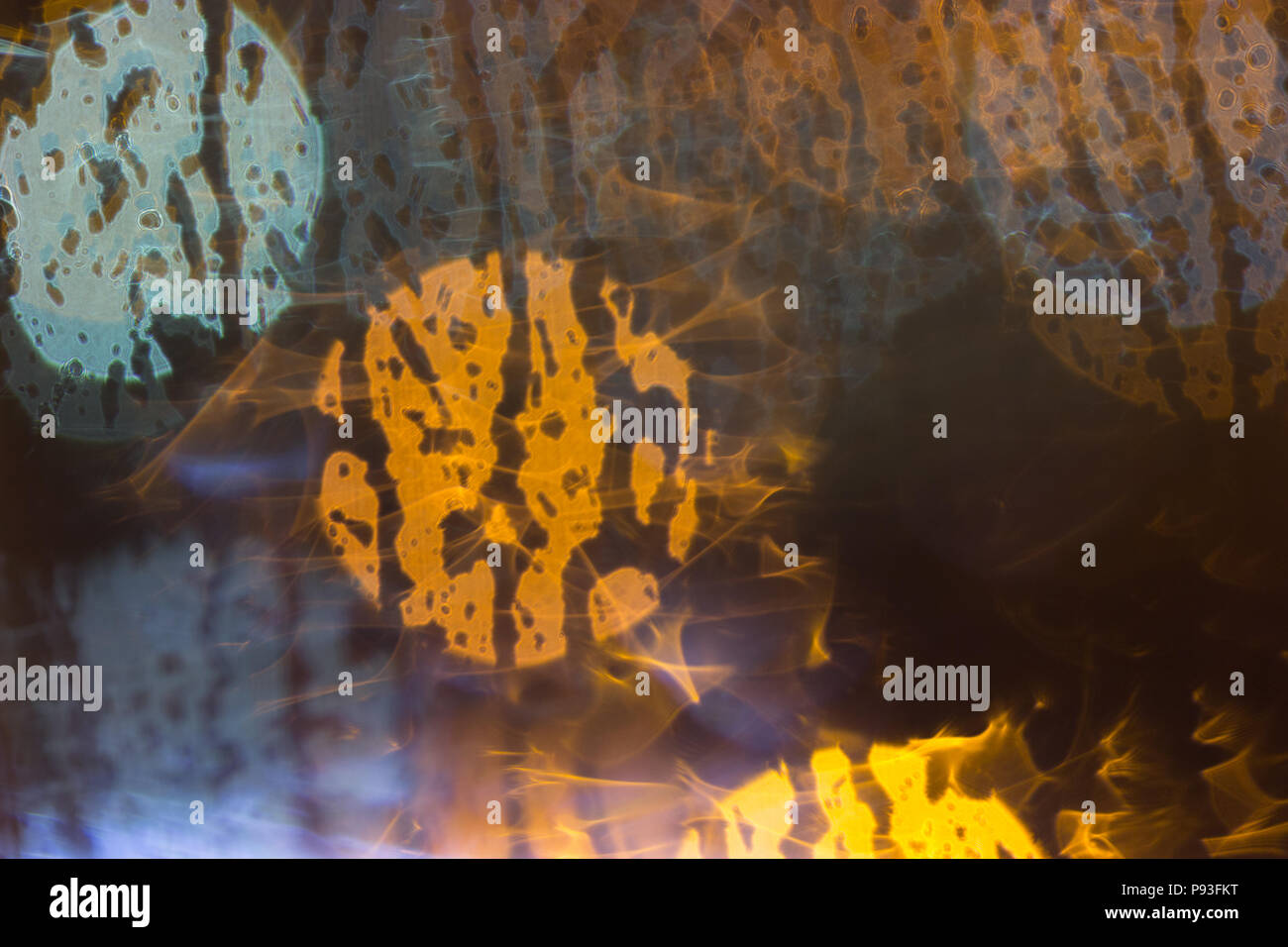 Drops of rain on window, night. blurred light Stock Photo - Alamy