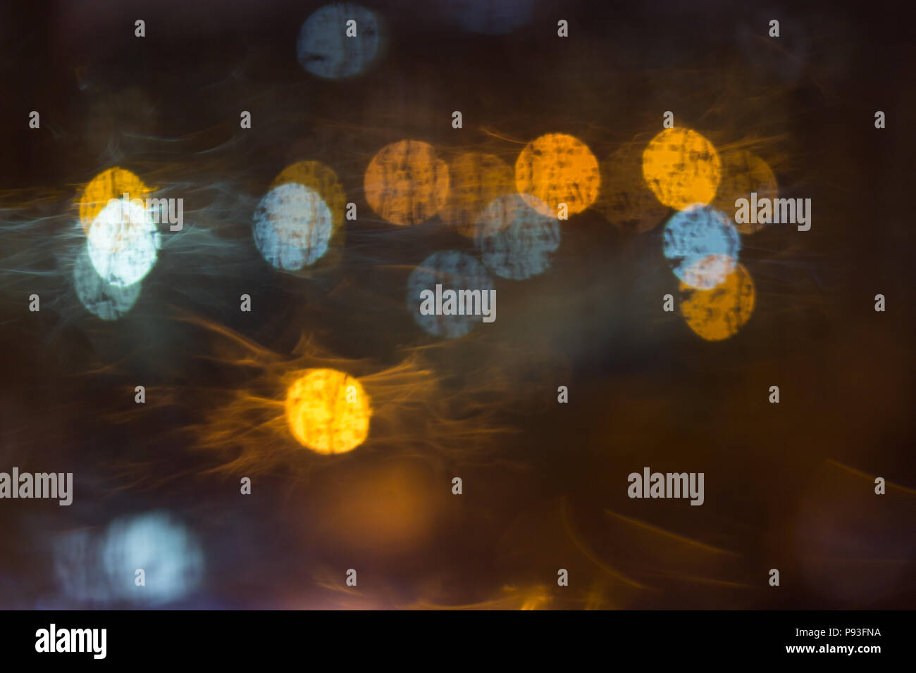 Drops of rain on window, night. blurred light Stock Photo - Alamy