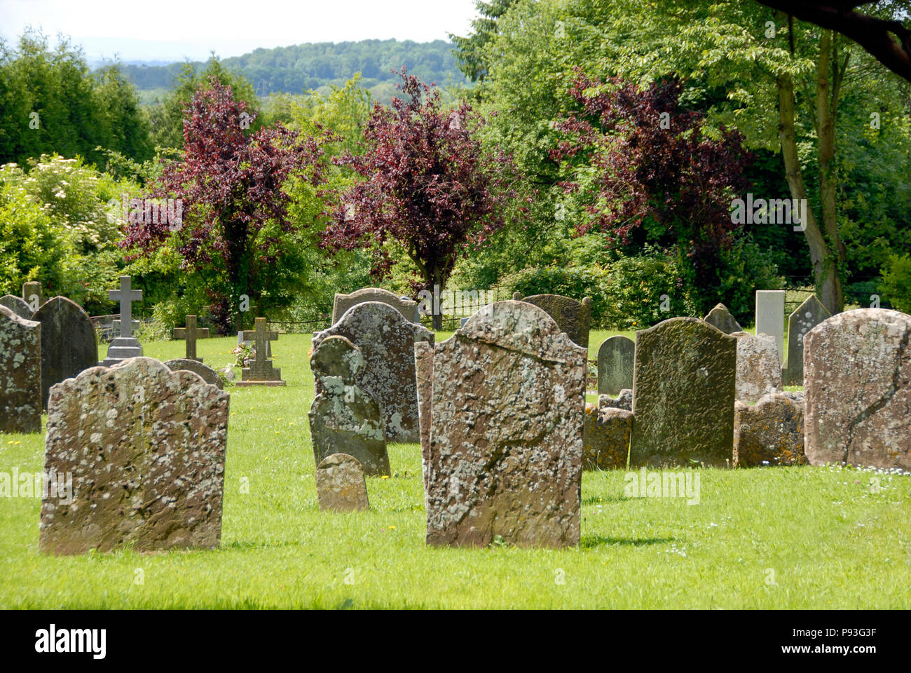 Grave stones in an English country churchyard Stock Photo - Alamy