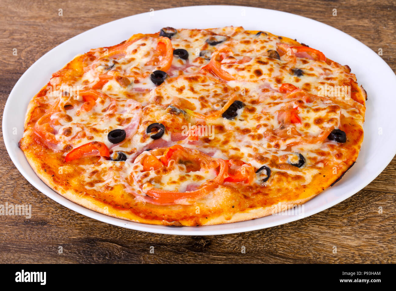Pizza with ham and cheese Stock Photo - Alamy