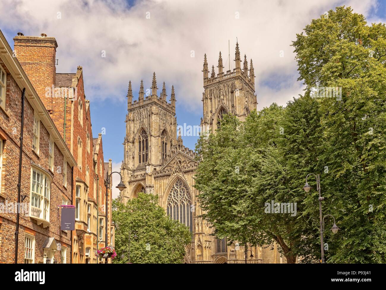 The west towers of York Minster looking down Duncombe Place. Brick ...