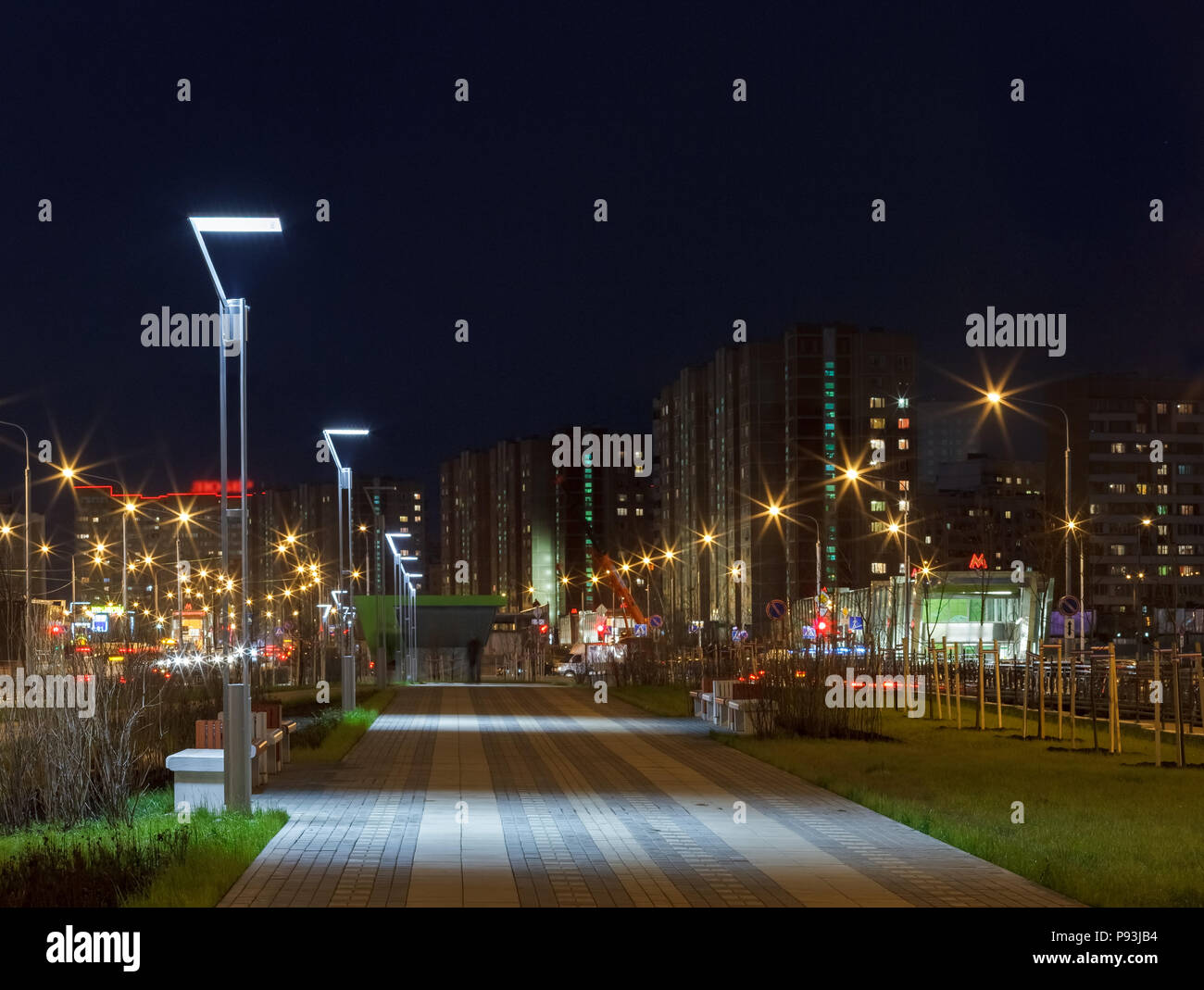 Street lights on boulevard and illuminated subway staiton Stock Photo ...