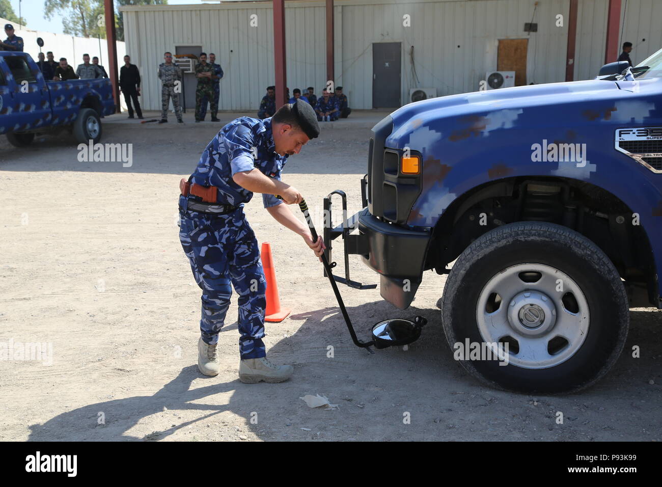 Iraqi members with the Federal Police set up a tactical checkpoint and ...