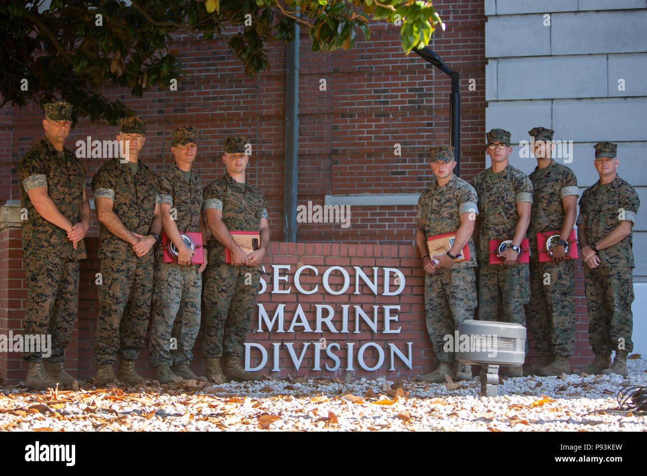 U.S. Marines and Sailors with 2nd Marine Division (2D MARDIV) pose with ...