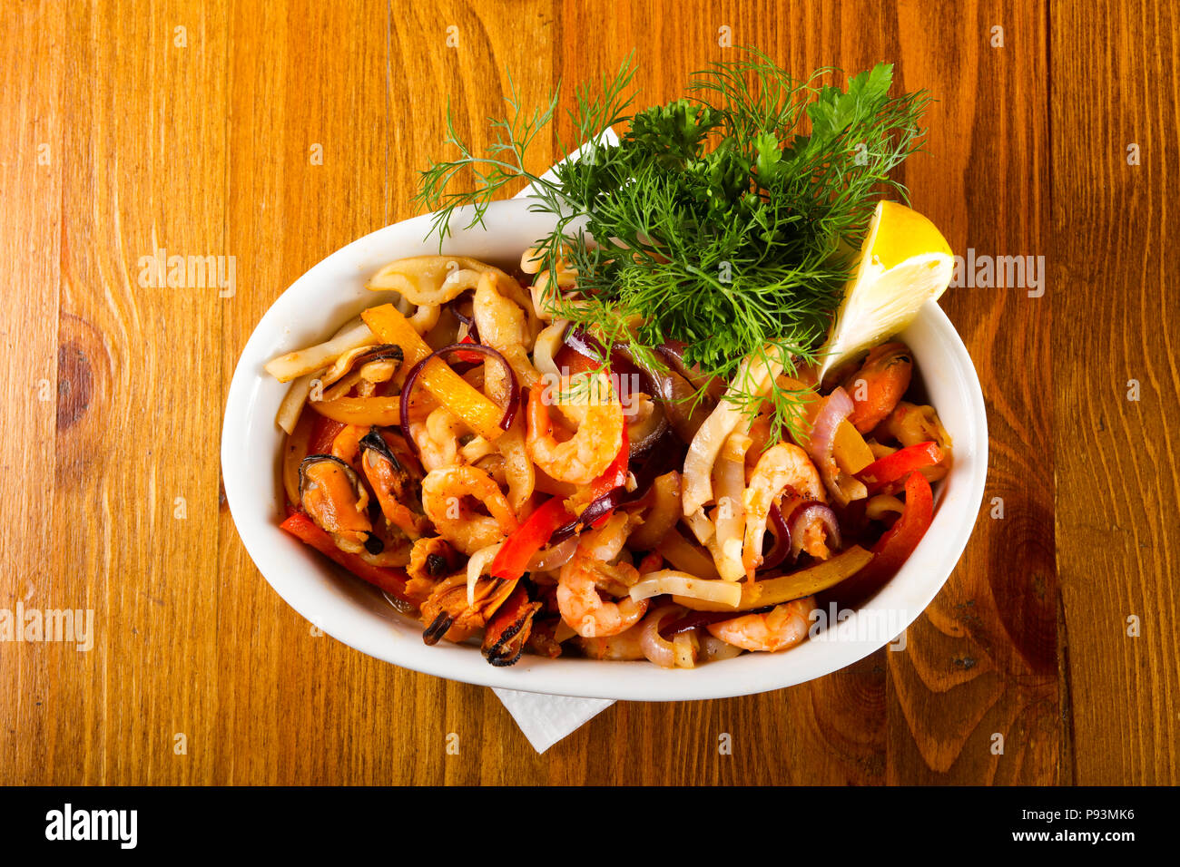 Seafood cocktail with squid, mussels and shrimps Stock Photo - Alamy