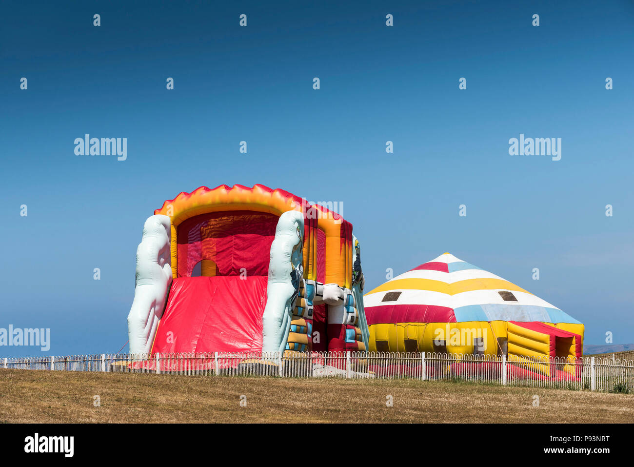 Large colourful bouncy castles on Barrowfields in Newquay in Cornwall ...