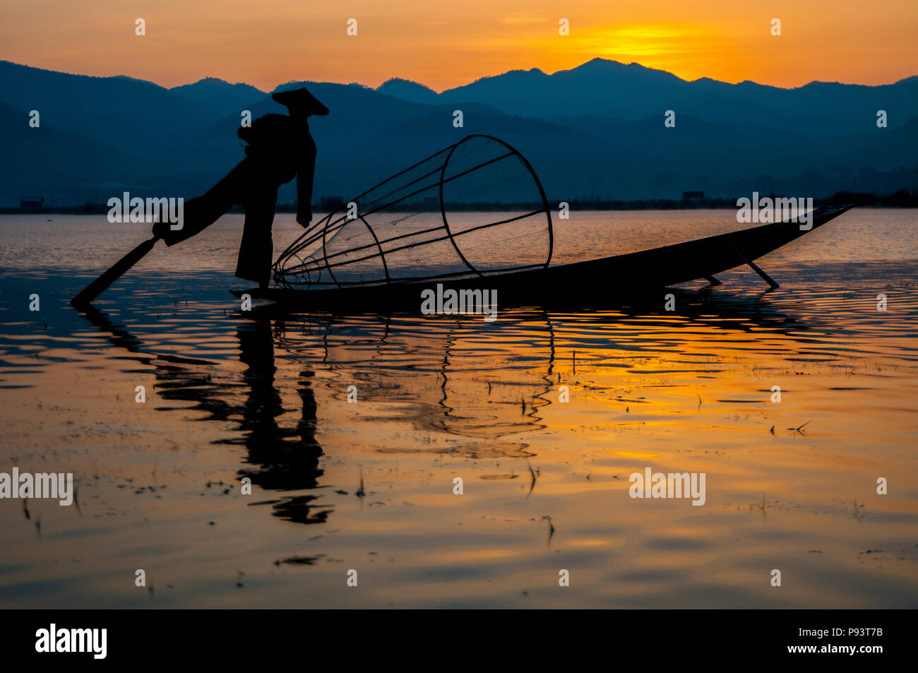 Traditional fishing during sunrise at Inle Lake Stock Photo - Alamy