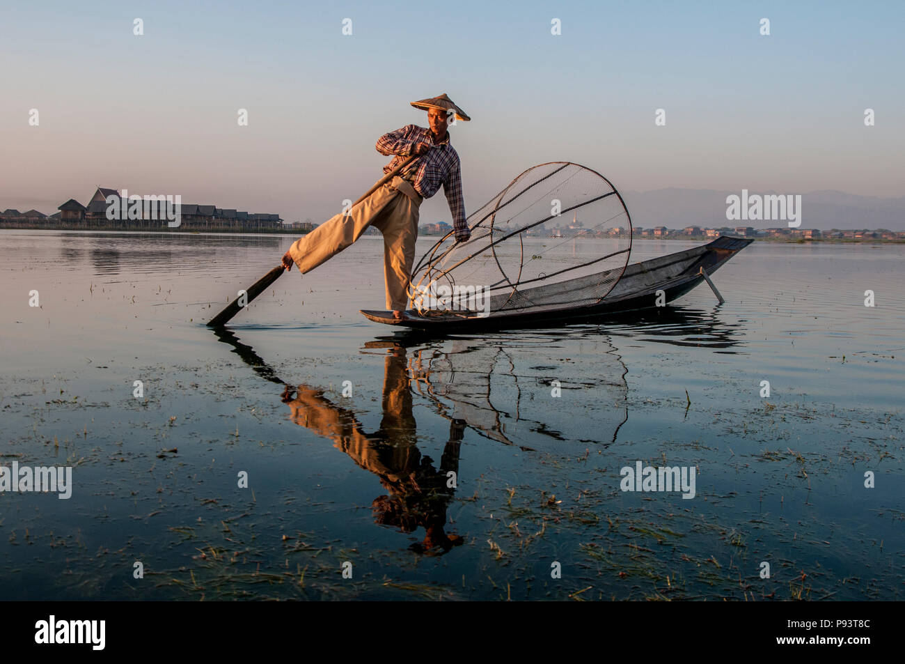 Traditional fishing during sunrise at Inle Lake Stock Photo - Alamy