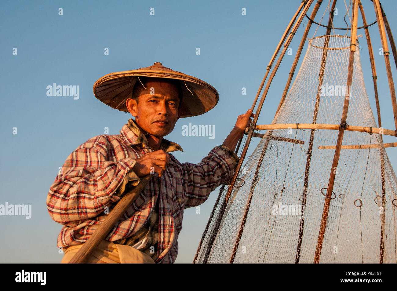 Traditional fishing during sunrise at Inle Lake Stock Photo - Alamy