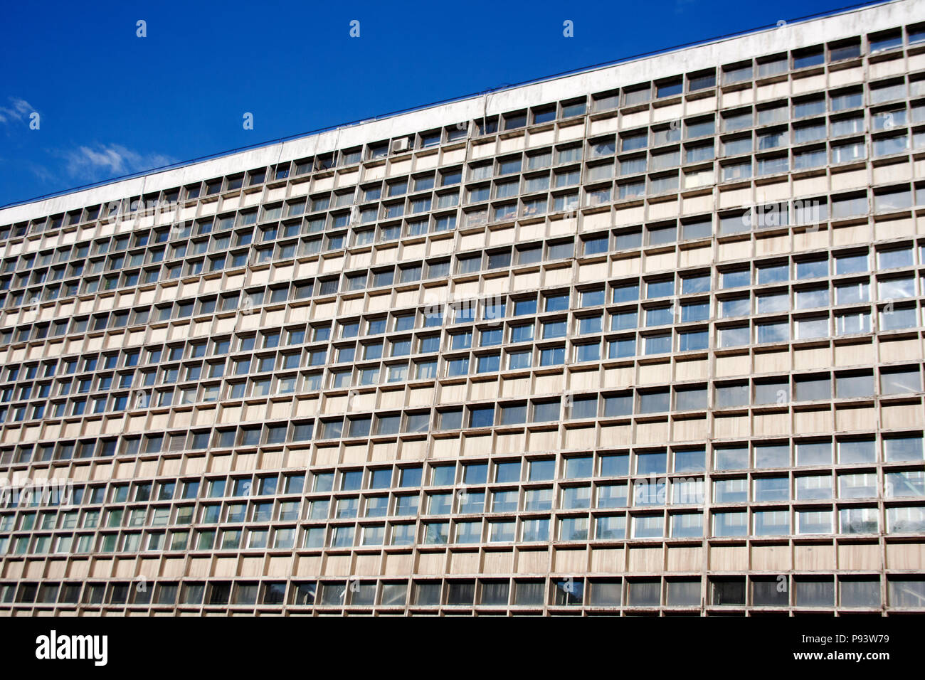 Industrial building exterior with geometric pattern on a summer day ...