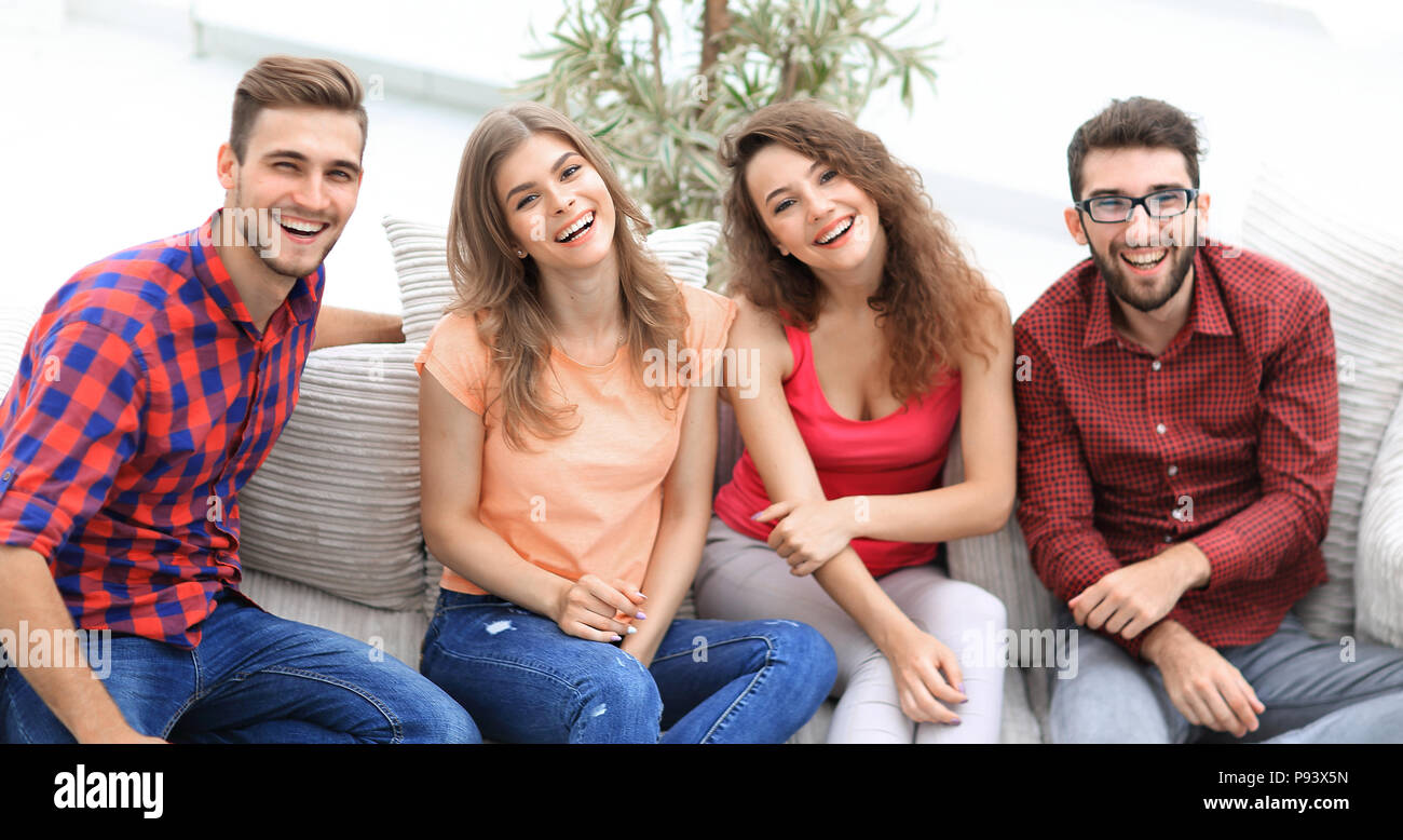 cheerful friends laughing in the living room Stock Photo - Alamy