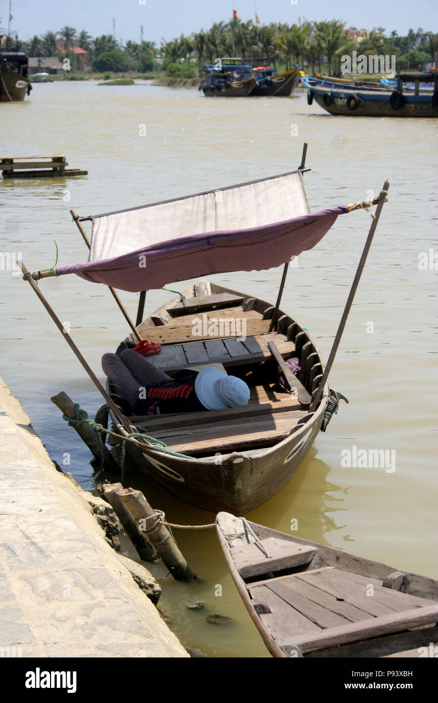 Person Sleeping in Wooden Boat, Hoi An, Vietnam Stock Photo - Alamy