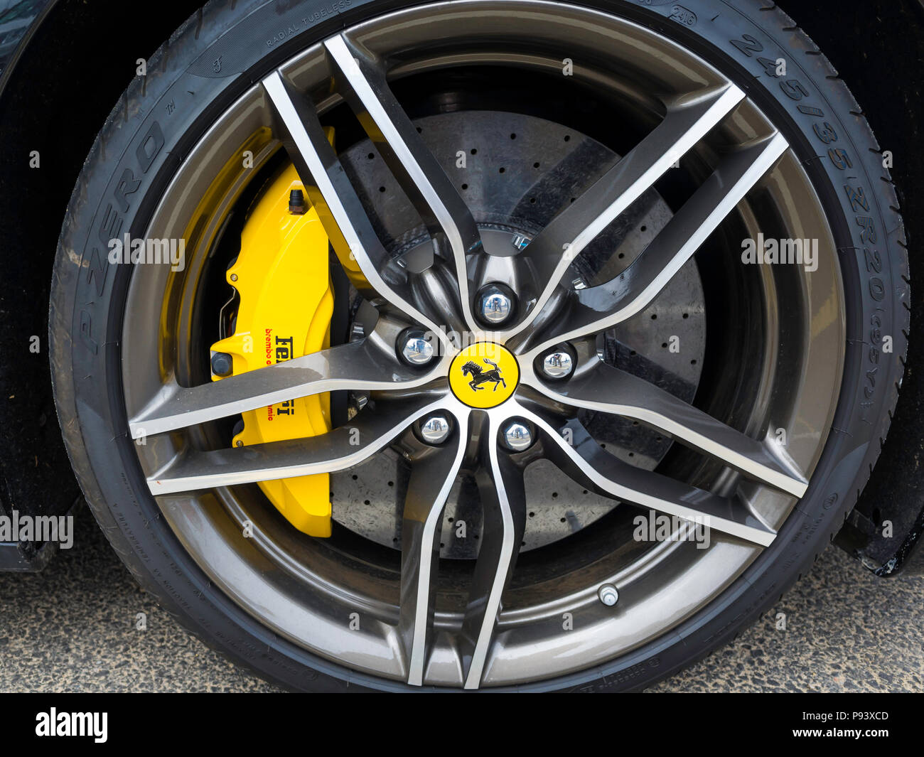 Black Ferrari Sports car detail showing five spoked alloy wheel and ...